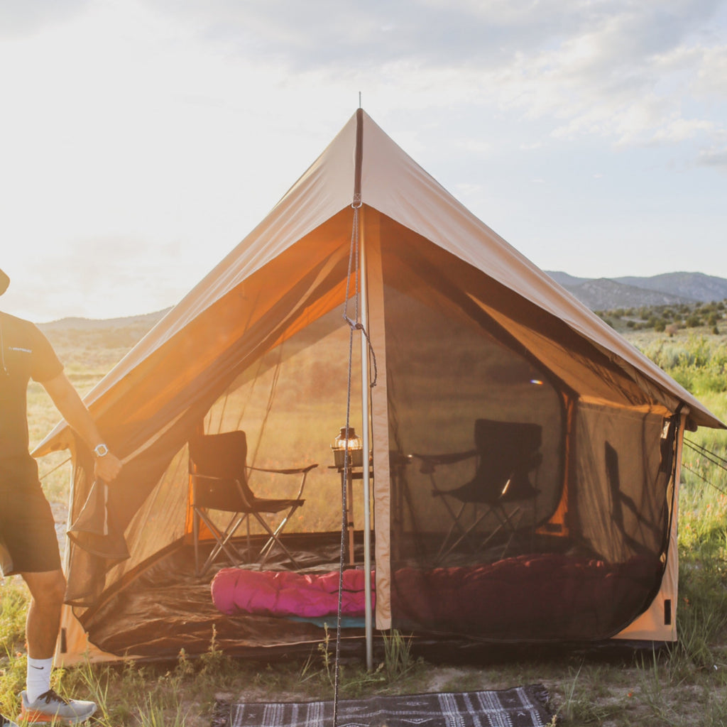 Rover scout tent placed outdoors in the sunlight with mesh partially ...